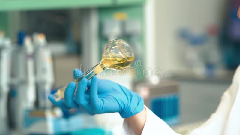 Mixing a Chemical Solution in a Glass Container during Research in a ...