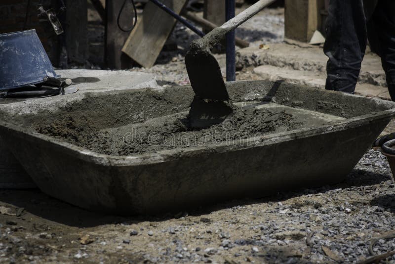 Mixing concrete with sand stock image. Image of tray - 89686165