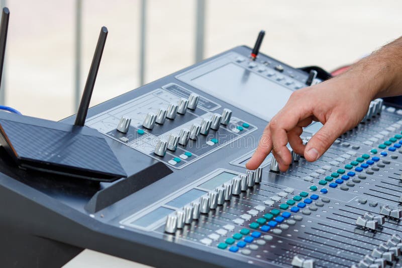 Mixing Console and a Man`s Hand Reaches for the Keys Stock Image ...