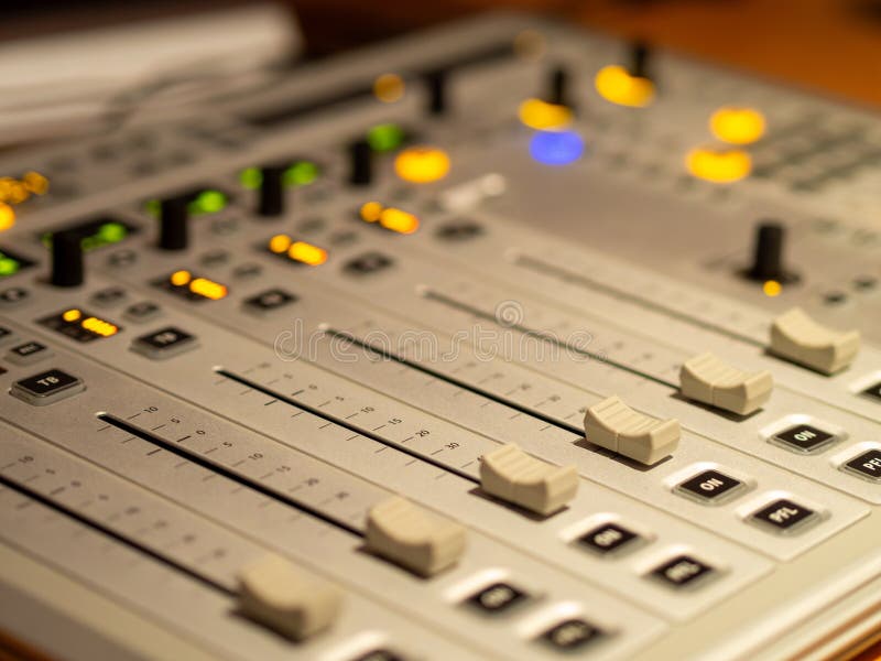 Mixing Console in a Music Studio Setting with Illuminated Controls ...