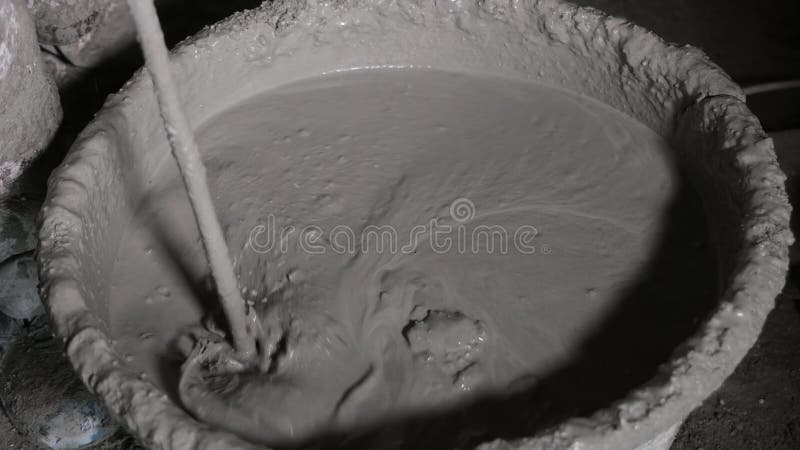Mixing Liquid Cement for Construction, Close-up of Liquid Cement Being ...