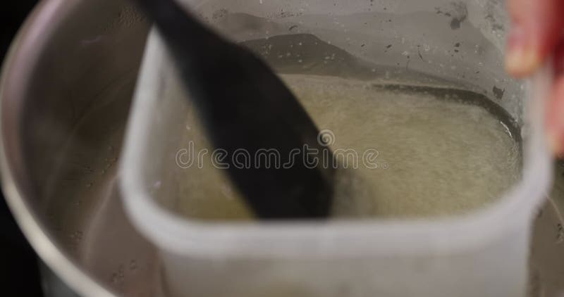 Mixing Liquid Gelatin or Egg White in Plastic Container for Cooking ...