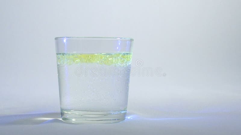 Mixing of Liquids in a Glass or Dissolution Stock Footage - Video of ...