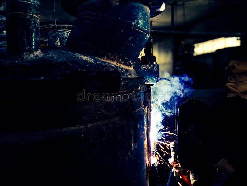 Mixing Machine Repair in Welding Machine Operator Editorial Image ...