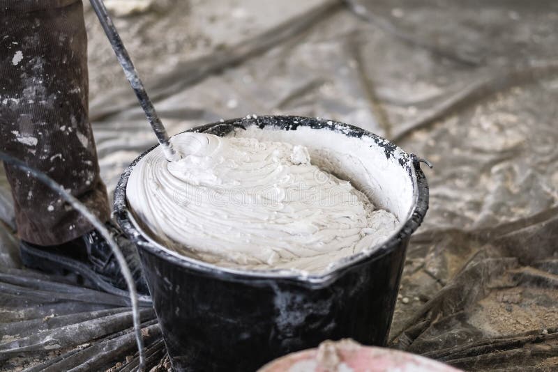 Plaster is Mixed in a Bucket Stock Photo - Image of bucket, blend ...