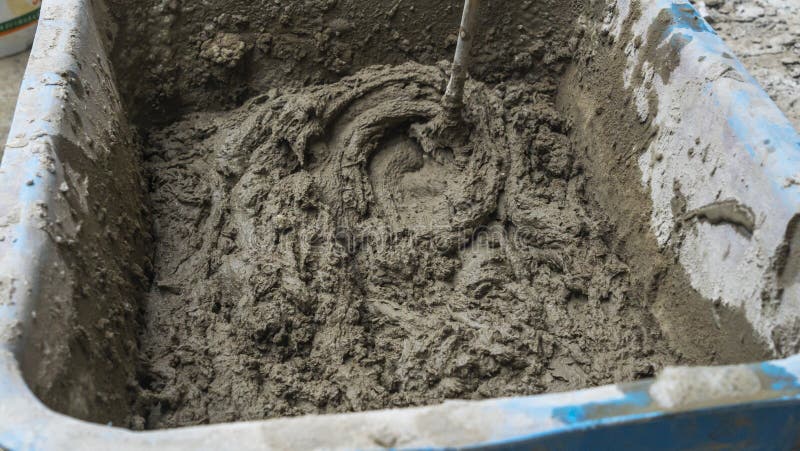 Mixing Tile Adhesive or Cement with a Power Drill for Repair Works on ...