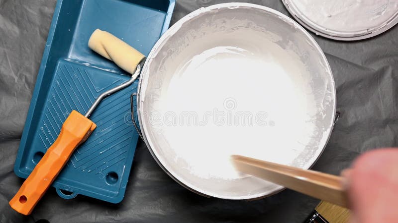 Mixing white paint stock footage. Video of painting - 295732280