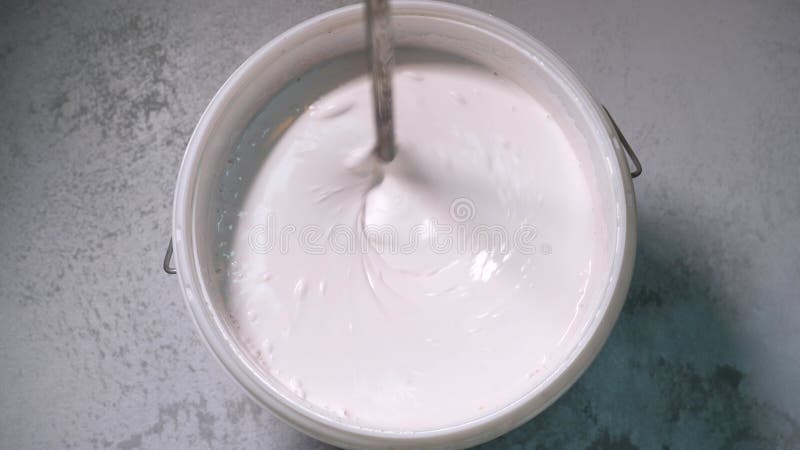Mixing White Paint in a Bucket. Top View Stock Video - Video of ...