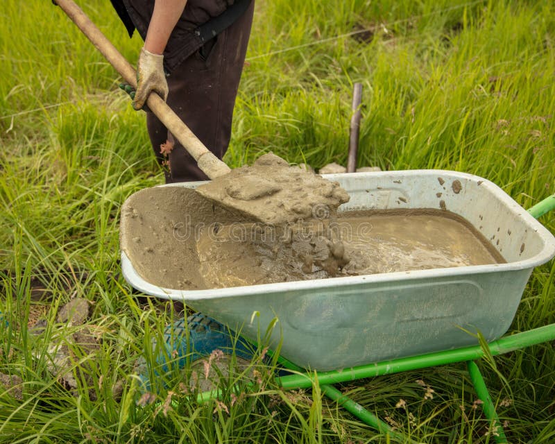 Mixture of Concrete in a Wheelbarrow at a Construction Site Stock Photo ...