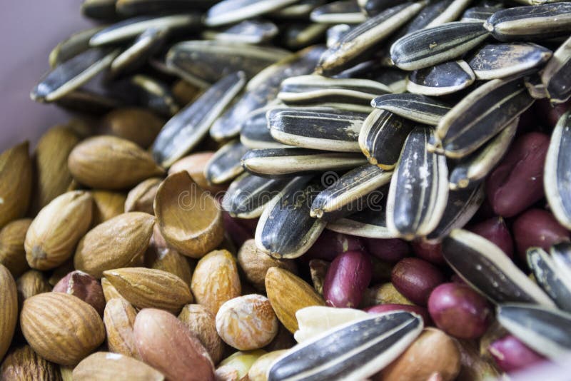 A Mixture of Different Types of Nuts and Seeds. Ground Nuts, Almonds ...