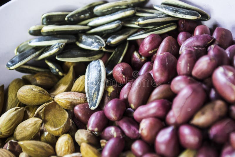 A Mixture of Different Types of Nuts and Seeds. Ground Nuts, Almonds ...