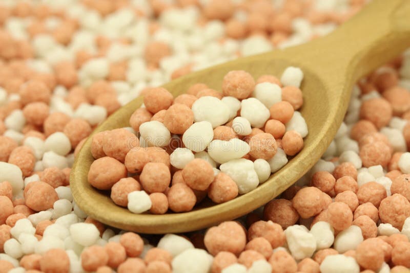 Mixture of Nitrogen Fertilizer Pellets in a Wooden Spoon Stock Photo ...