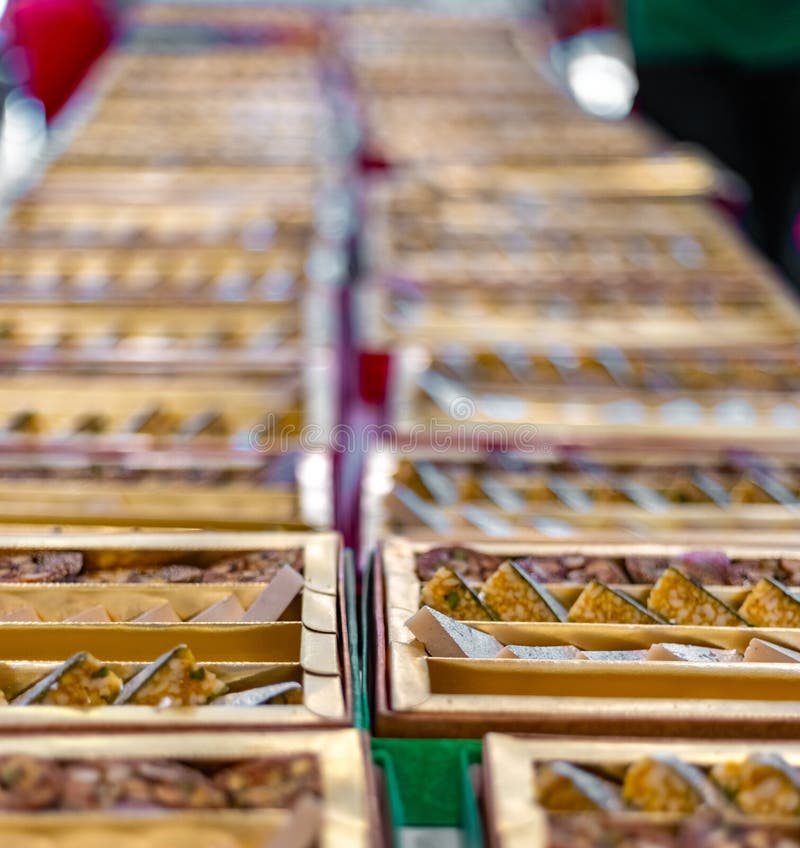 A Mixture of Various Indian Sweets Packed in a Box. Peda, Laddu, Mithai ...