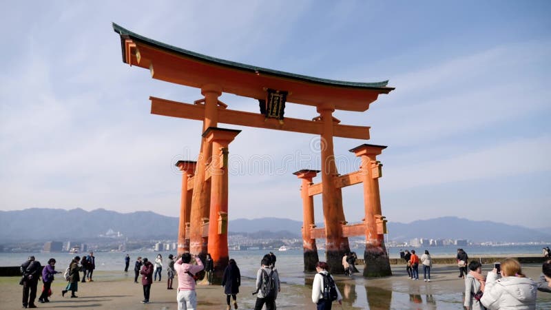 People Walking in Front of the Great Torii of Miyajima. Floating Torii ...