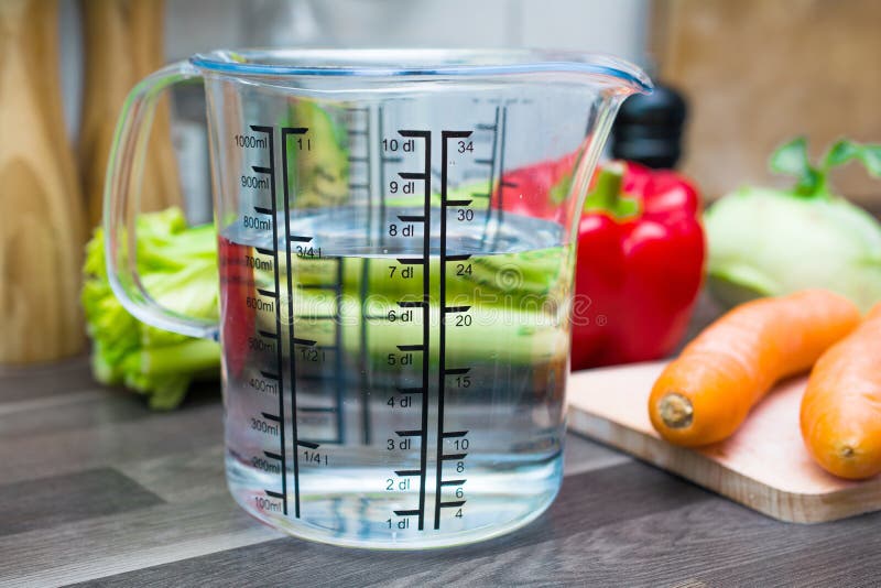 700ml / 7dl of Water in a Measuring Cup on a Kitchen Counter with ...