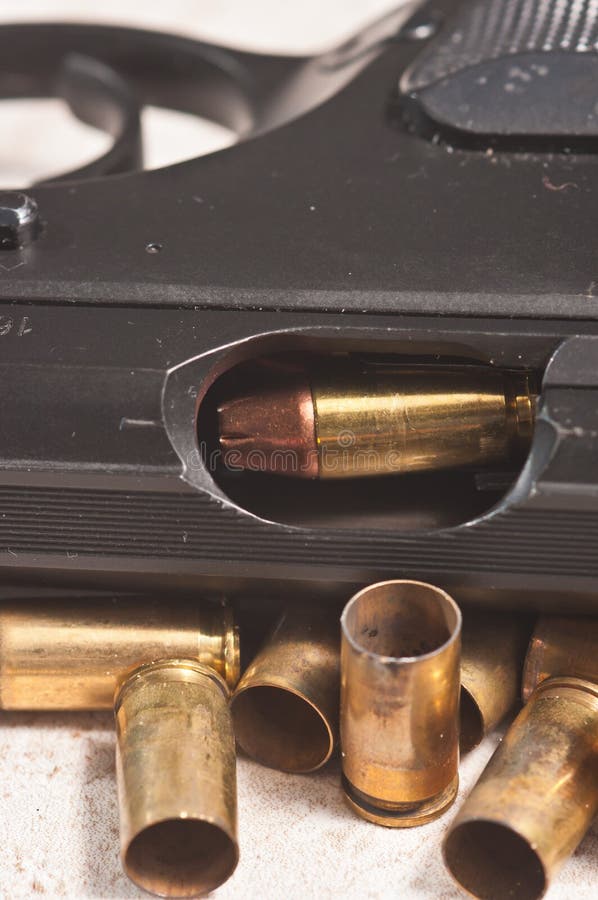 9 Mm Defensive Round of Ammo, Being Chambered into a 9 Mm Handgun and ...