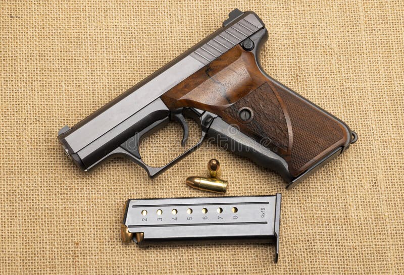 9 Mm Gun , Automatic Handgun with Bullet Magazine on Burlap Background ...