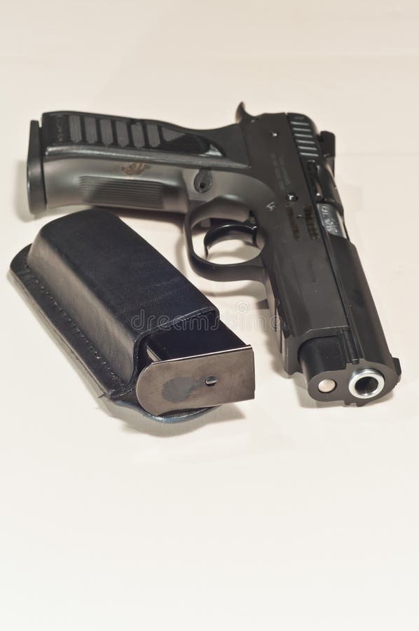 9-mm Hand Gun with a Black Leather Holster Containing an Extra 9-mm ...