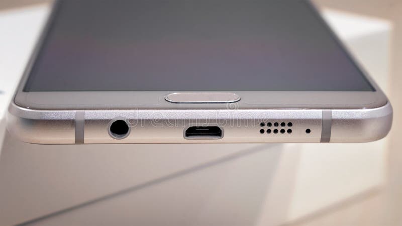 3.5mm Headphone Jack and Micro USB Charging Port at the Bottle of a ...