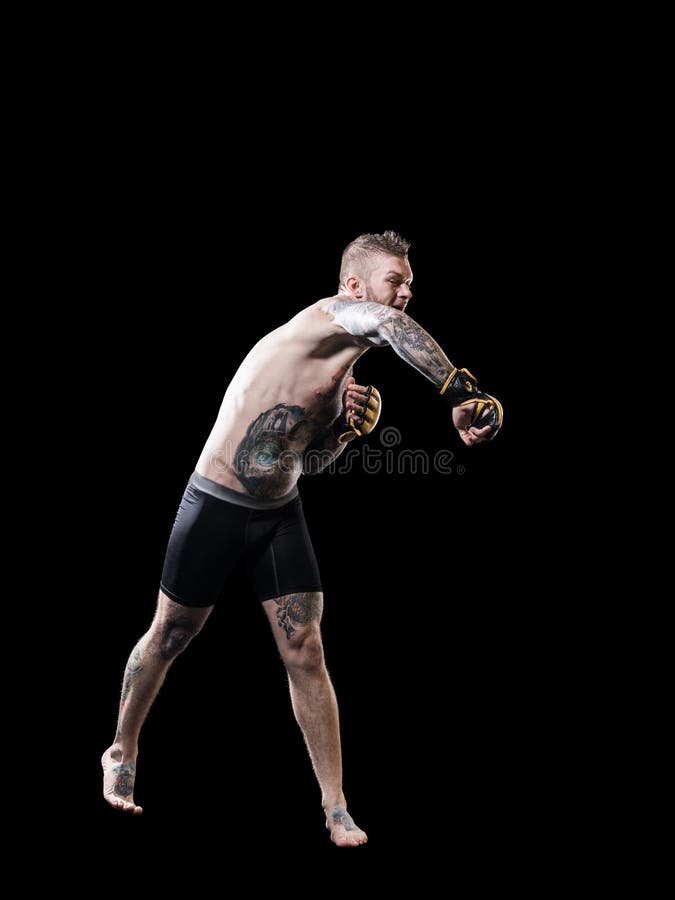 MMA Fighter Practising Punching on Black Background Stock Image - Image ...