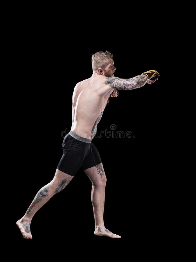 MMA Fighter Practising Punching on Black Background Stock Photo - Image ...