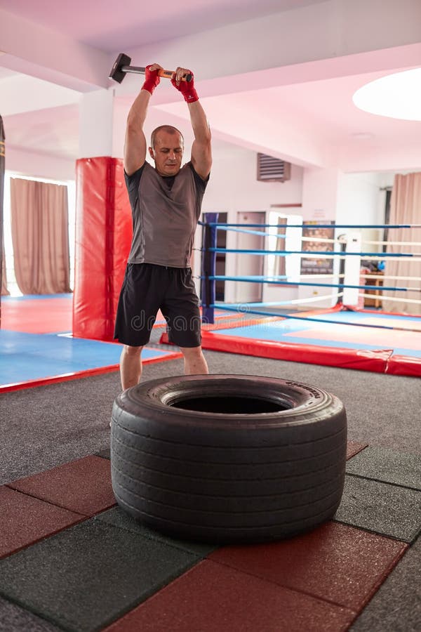 MMA Fighter with Sledgehammer Stock Photo - Image of mature, hands ...