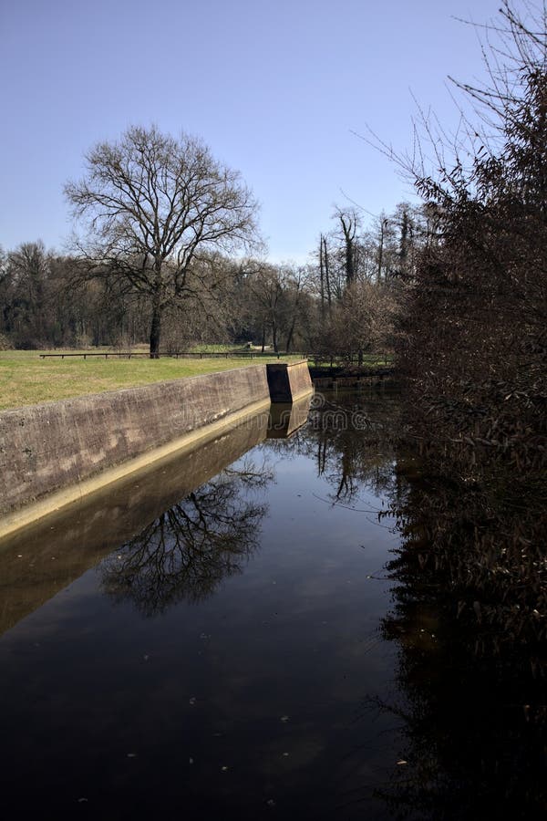 Moat in a park stock photo. Image of house, grass, bridge - 368849418
