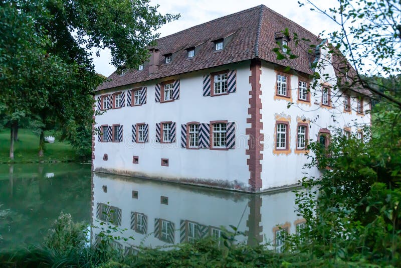 Moated castle with moat stock photo. Image of inzlingen - 261024712