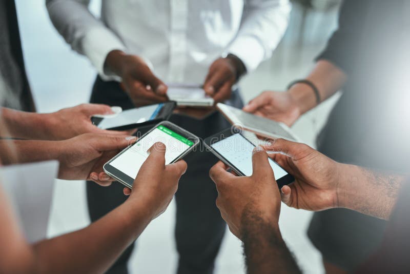 Mobile Apps that Make Things Happen. a Group of Businesspeople Using ...