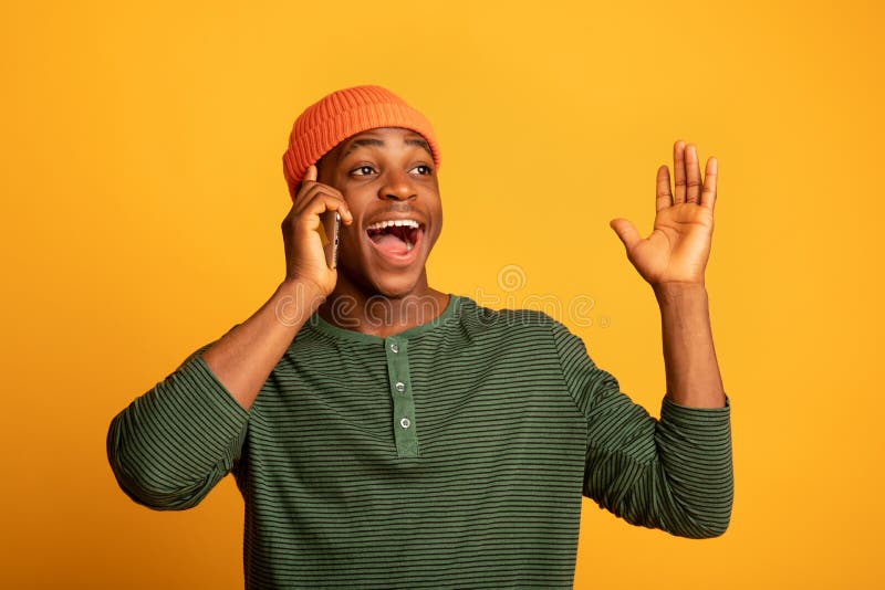 Mobile Call Portrait Of Excited Emotional Black Guy Talking On