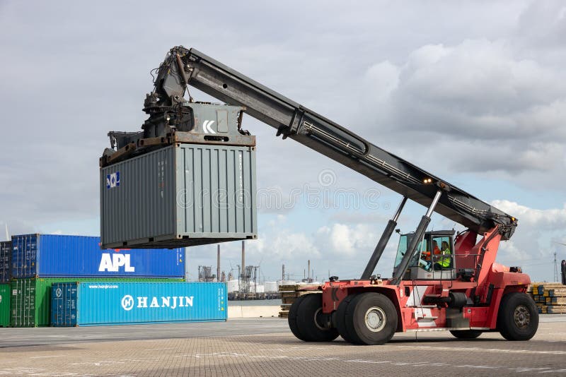 Mobile Container Handler in Action at a Container Terminal in the Port ...