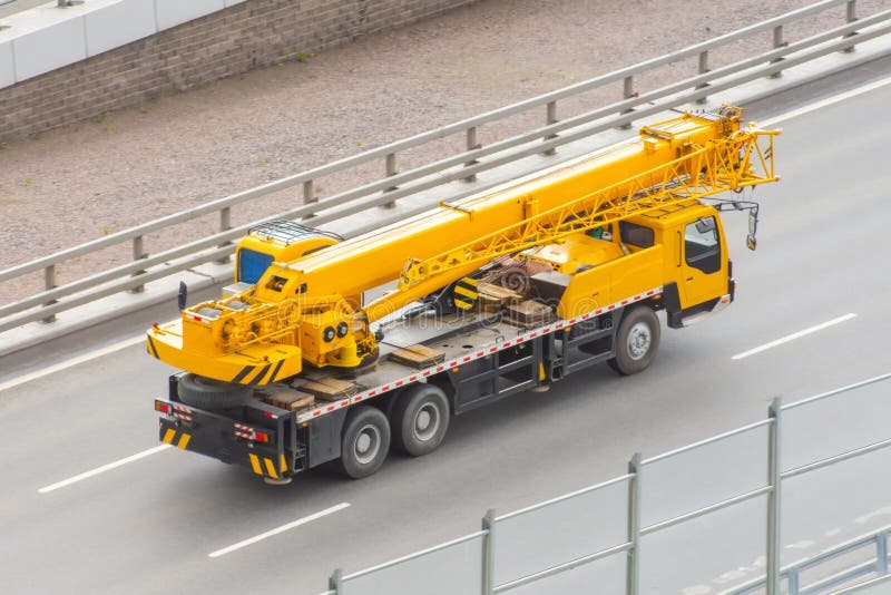 Mobile Crane Truck Driving on the Highway Stock Photo - Image of ...