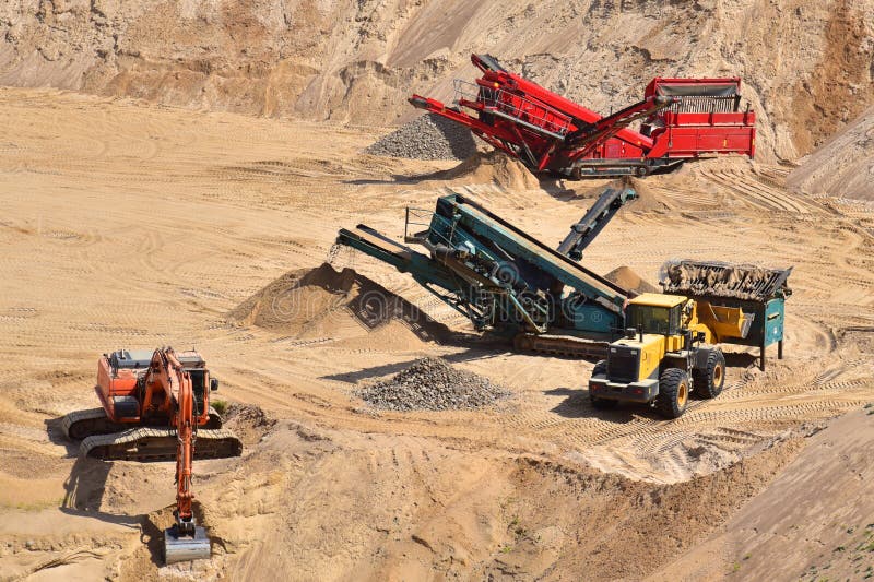 Mobile Crushers and Screens in Open Pit. Wheel Front-end Loader Loads ...