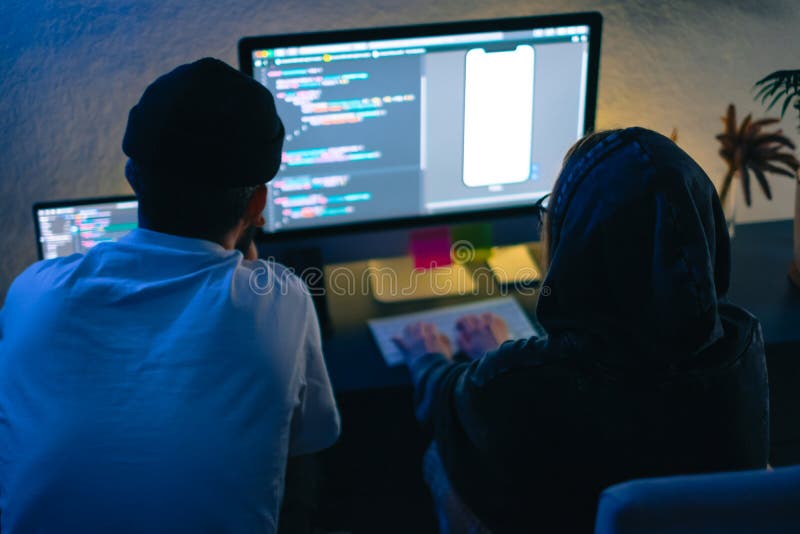 Mobile Developers Team Writes Program Code On A Computer Programmers Work In Home Office Stock