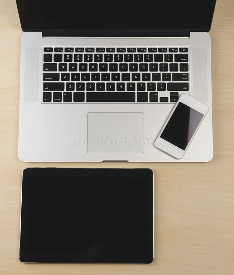 Mobile devices on table stock image. Image of internet - 64281873