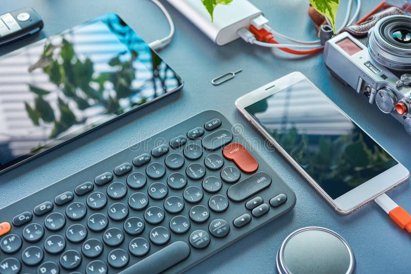 Mobile Devices on the Table Stock Image - Image of cable, power: 171905395