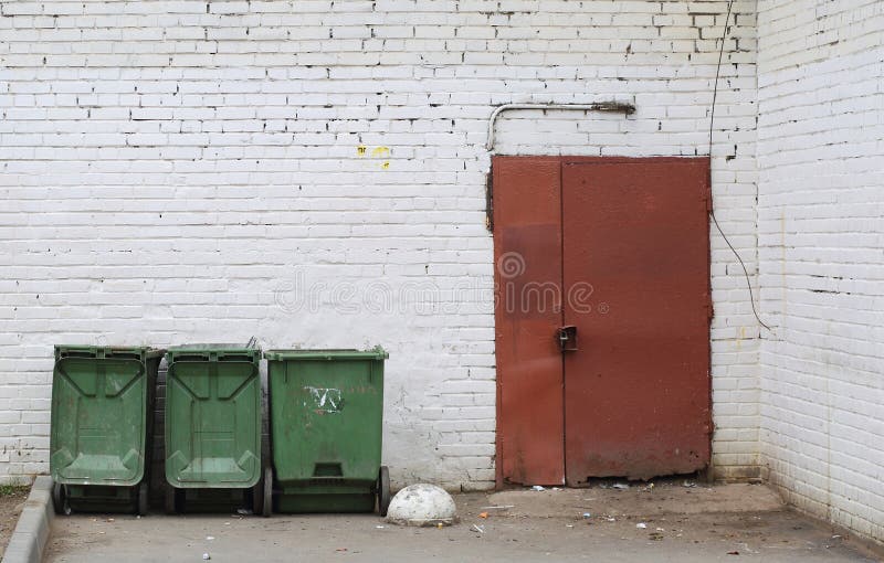 Mobile Garbage Containers Green Near the Wall of the House Stock Photo ...