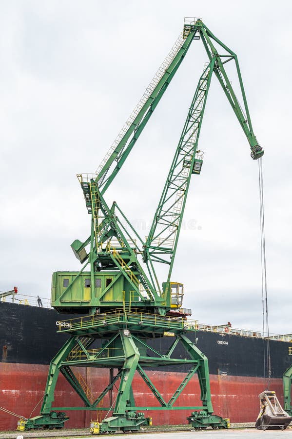 Bulk-handling Crane Unloading Sand, Road Metal and Gravel from Cargo ...