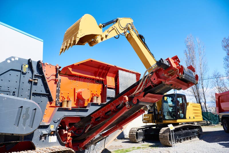 Mobile Impact Crusher and Bucket Excavator Stock Photo - Image of ...