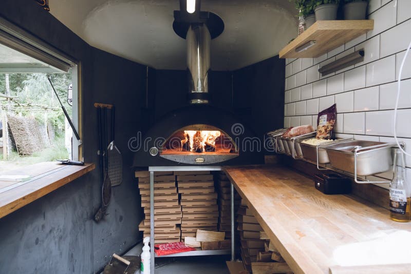 A Mobile Kitchen with a Pizza Oven Burning Inside Stock Photo - Image ...