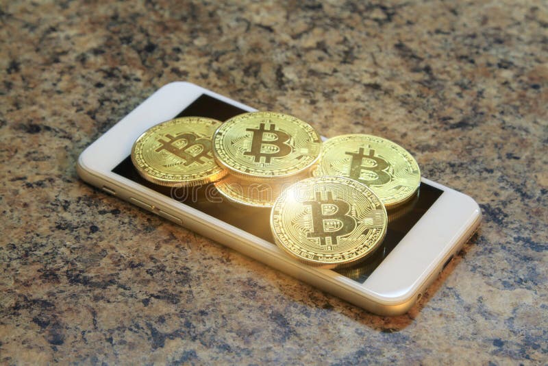 Mobile Phone with Bitcoin Cryptocurrency Coins on Granite Table Stock ...