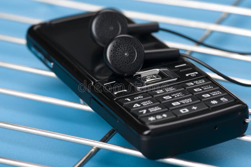 Mobile phone on blue stock image. Image of equipment - 11546423
