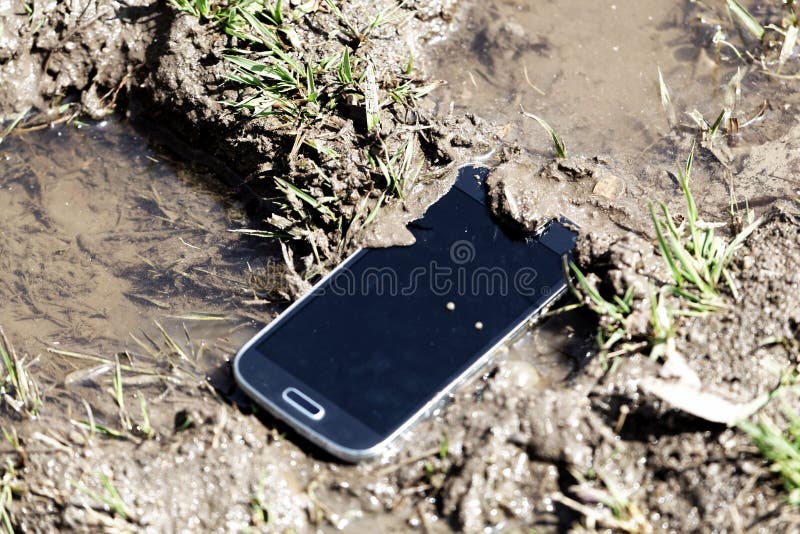 Mobile Phone in Brown Mud with Water Stock Image - Image of destroyed ...