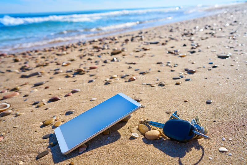Mobile Phone and Car Keys on Beach Sand Stock Image - Image of beach ...