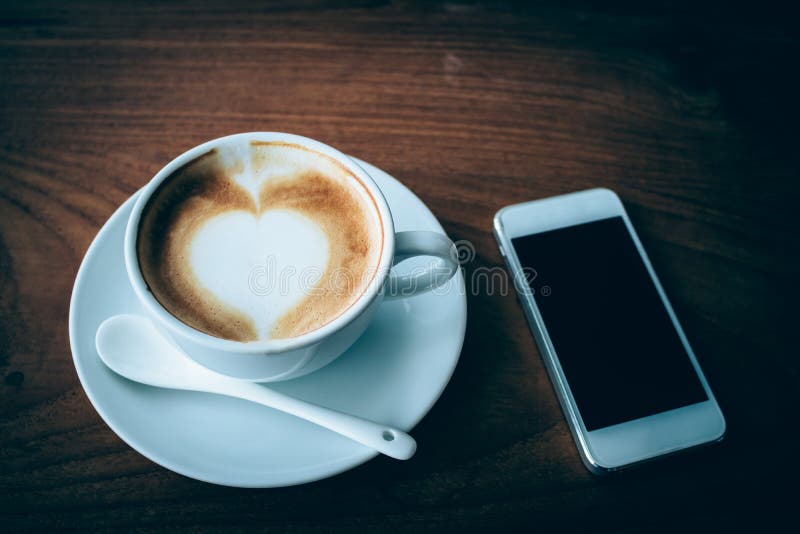 Mobile Phone and Coffee Cup on Wood Table Dark Tone. Stock Photo ...