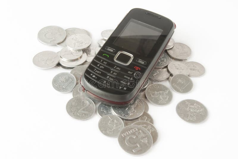 Mobile phone with coins stock image. Image of single - 14211645