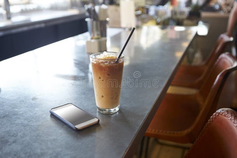 Mobile Phone and Cold Press Coffee on Cafe Counter Stock Image - Image ...