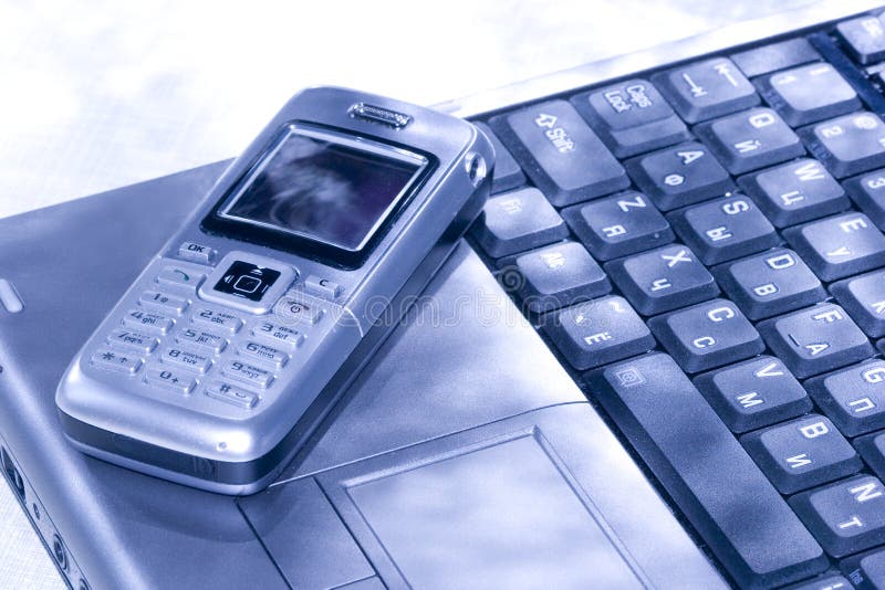 Mobile phone and computer stock image. Image of office - 3297131