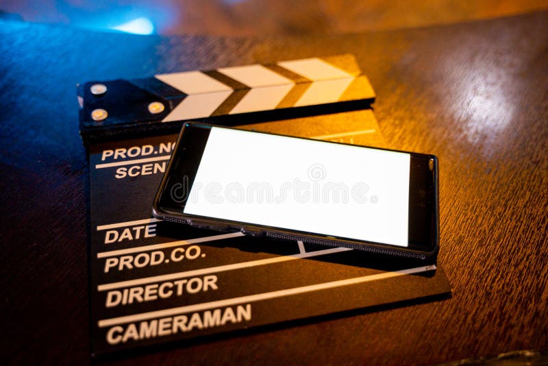 Mobile Phone with Empty White Bright Screen with Popcorn Bucket on the ...