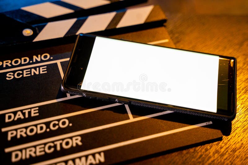 Mobile Phone with Empty White Bright Screen Movie Clapper Board ...
